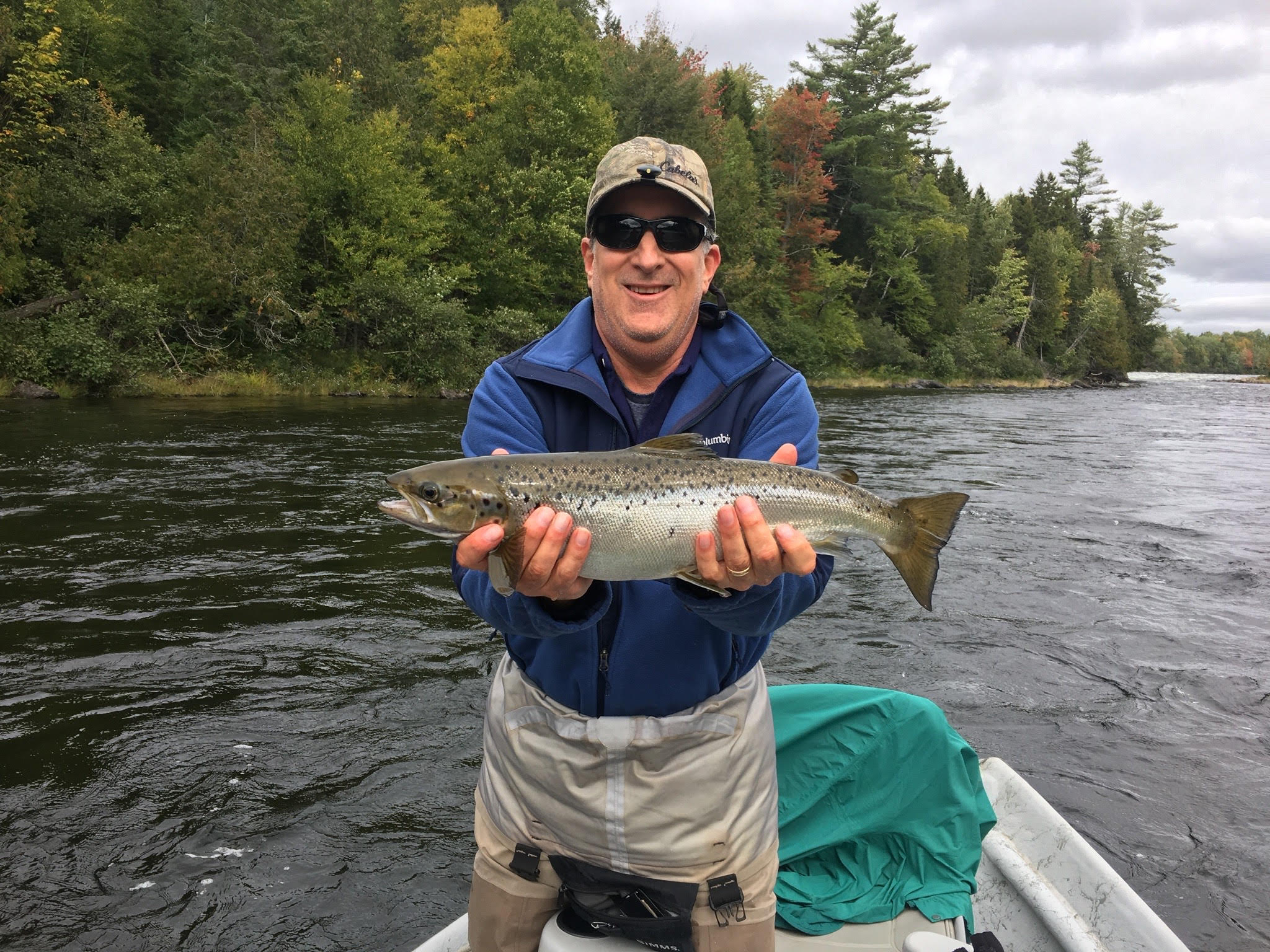 This angler shows off a nice salmon he caught on the East Outlet ...